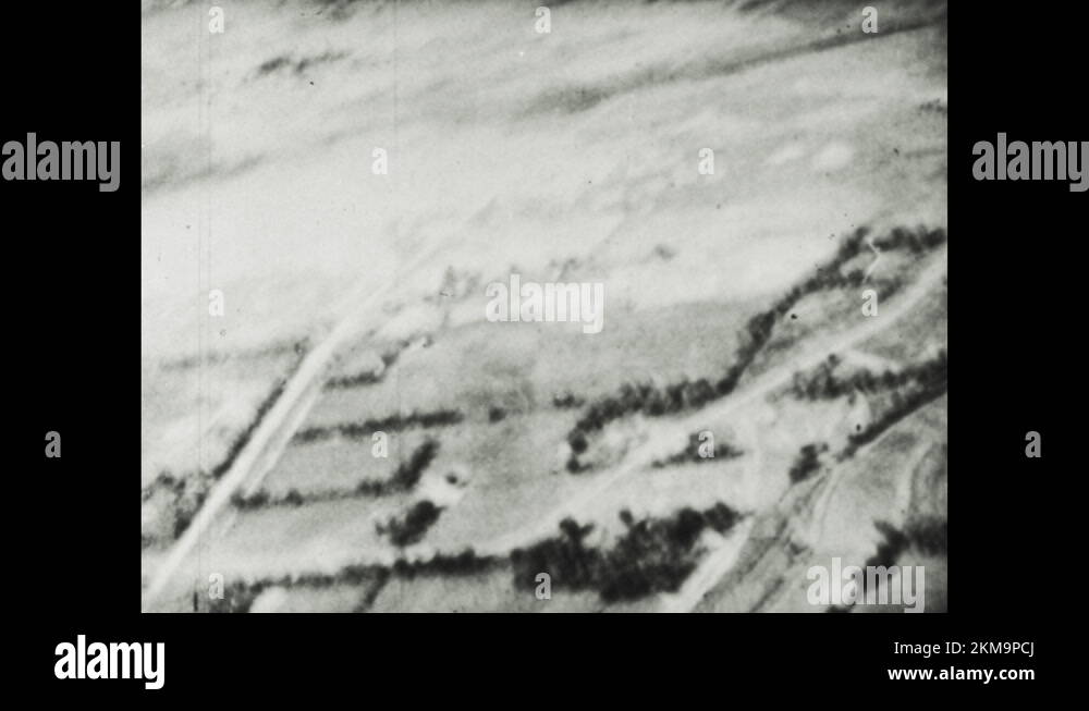 1940s: Aerial views of Asian lands being bombed. Squadron of American ...