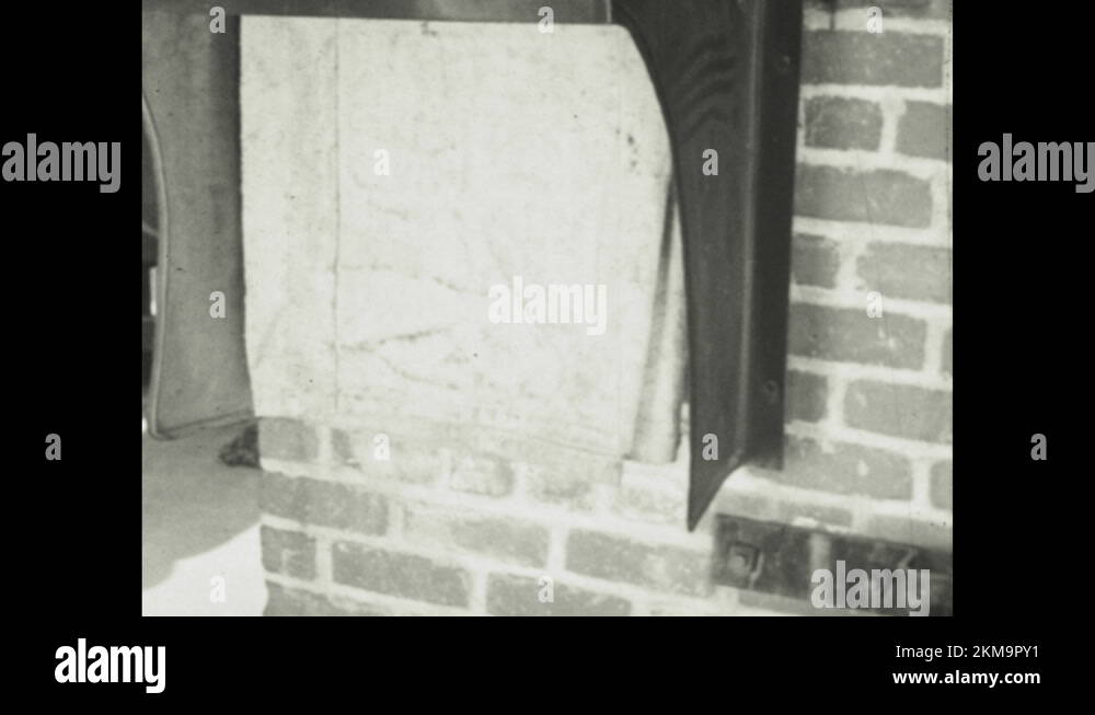 1940s: Fire marshall inspects dry cleaning facility. Man opens machine ...