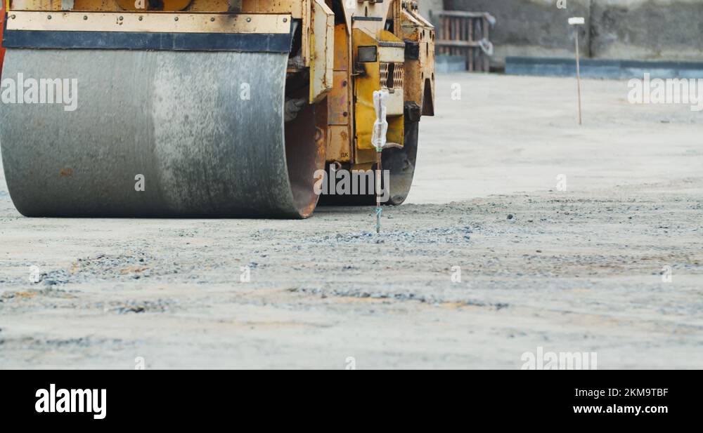 Road work heavy machinery at work, asphalt compactor is driving, 4k ...