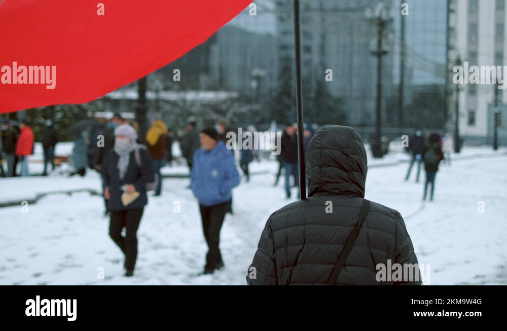 Communist march on city streets. Socialist with red revolutionary flags ...