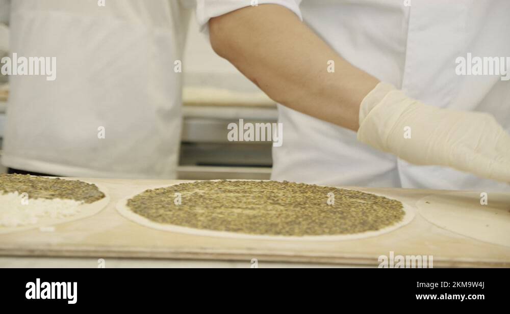 Adding Meat Toppings on Manakish flat bread dough or pizza Stock Video ...