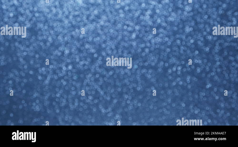 Glittering abstract blue bokeh background. Smoothly increase and ...