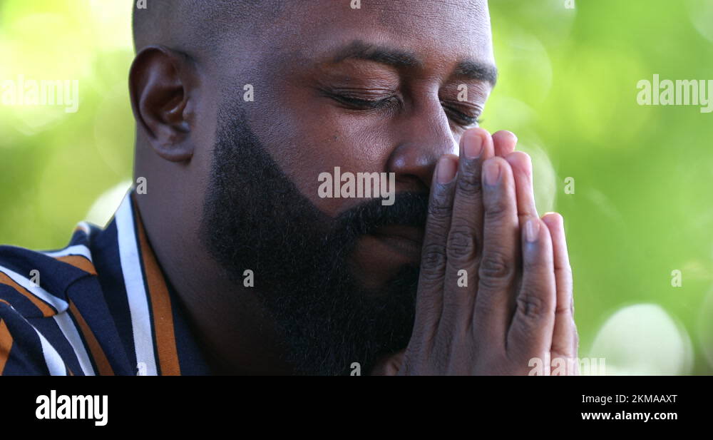 African man praying to God Stock Video Footage - Alamy