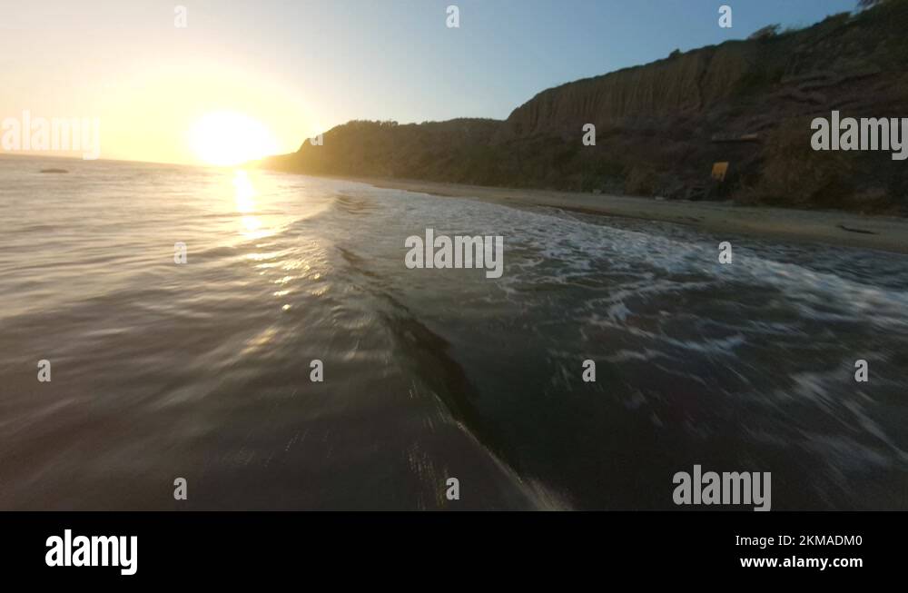 Close proximity flight above waves washing up on La Piedra beach in ...