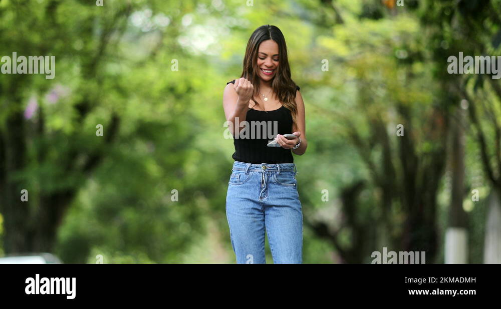 Joyful woman jumping with joy feeling ecstatic celebration Stock Video ...
