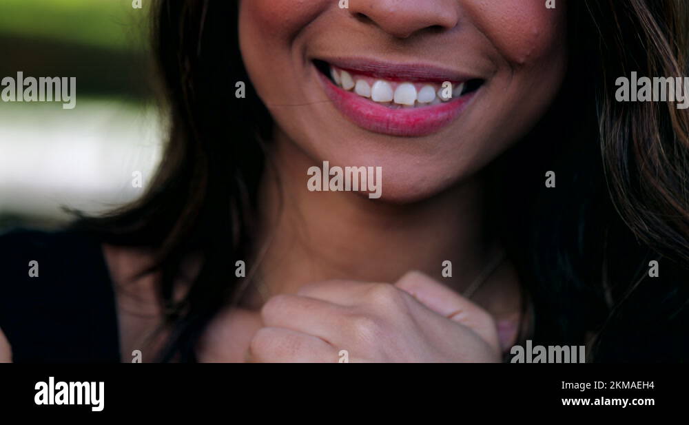 Woman feeling hope and satisfaction smiling feeling faithful and ...