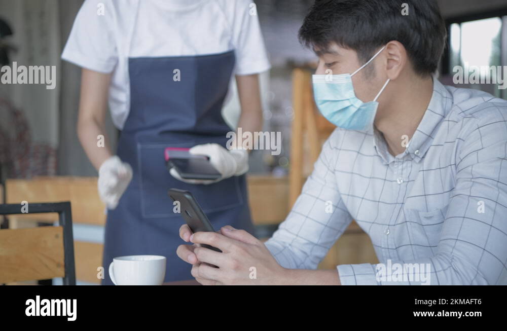 Coffee shop concept of 4k Resolution. Male customers are paying and ...