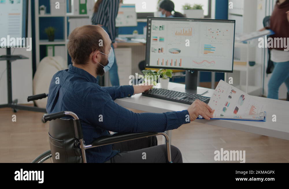 Paralyzed man and teamworkers working in new normal office Stock Video ...