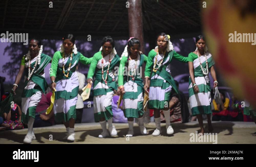 Rural women wearing saree performing tribal dance at evening on stage ...