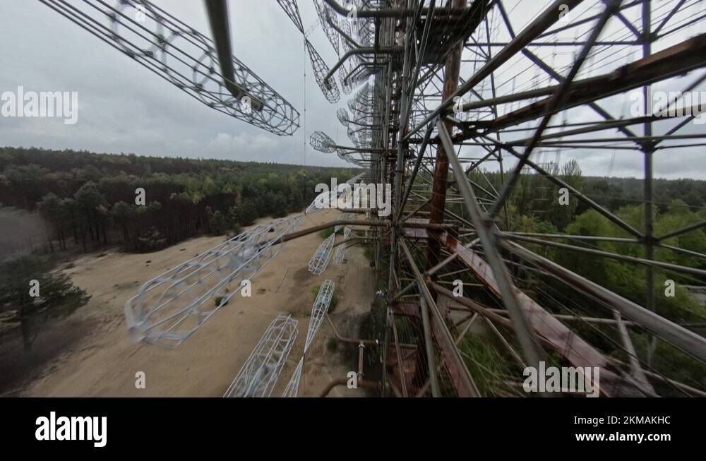 FPV drone view of over horizon duga radar system in the rain. The ...