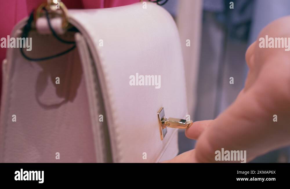 The buyer checks the reliability of the lock and the spaciousness of ...