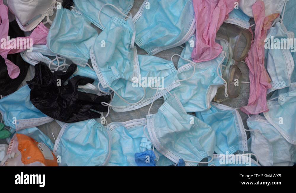 COVID-19 Waste Pollution crisis. Used discarded disposable face masks ...