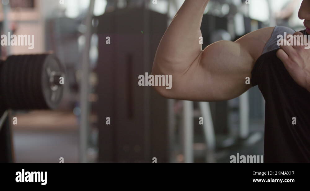 Young Chinese Man Flexing Muscles At Gym 4k Stock Video Footage Alamy