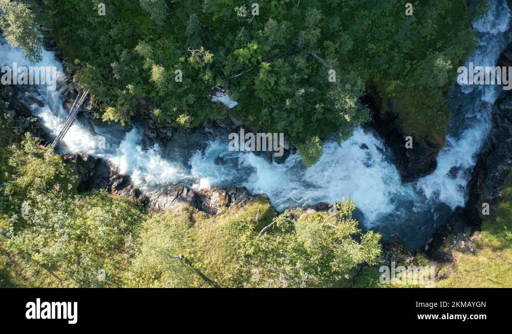 A view above the torrential flow of turbulent river, that makes an U ...