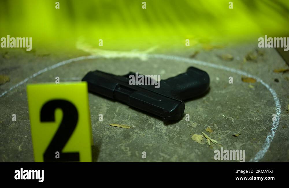 CSI Photograph Gun At Crime Scene, Murder Weapon With Evidence Markers ...