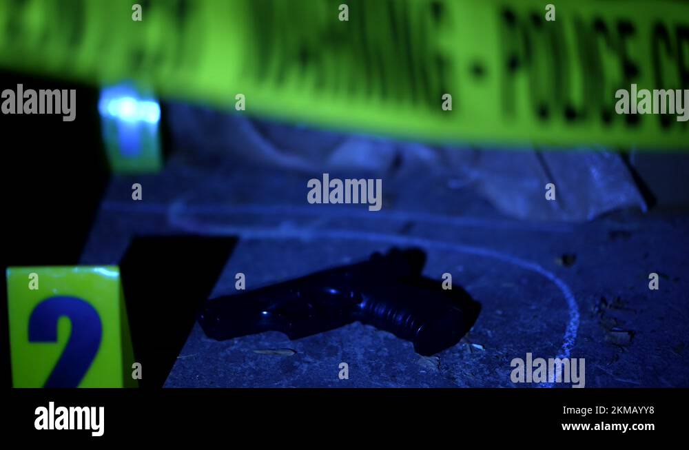 Gun At Crime Scene, Murder Weapon With Evidence Markers, CSI Stock ...