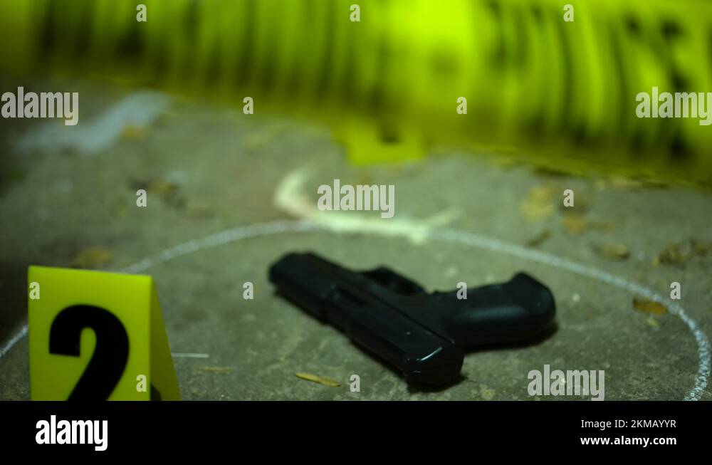 Gun At Crime Scene, Murder Weapon With Evidence Markers, CSI Stock ...