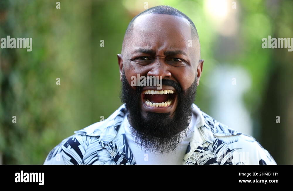 Upset Angry black man screaming at camera, portrait African descent ...