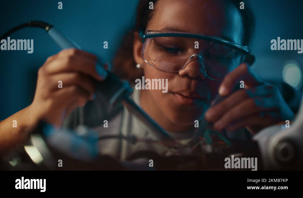 School Girl Soldering Science Project Stock Video Footage - Alamy