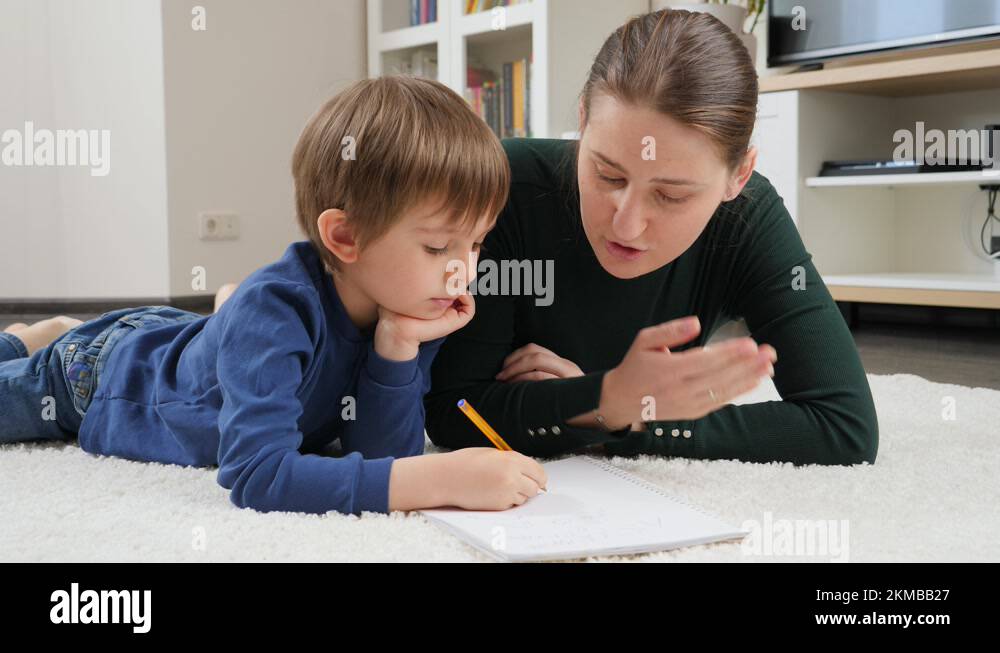 Young displeases mother shouting and talking strictly to her son doing ...