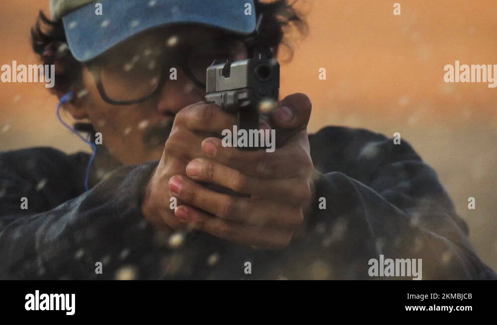 Man firing gun Stock Videos & Footage - HD and 4K Video Clips - Alamy