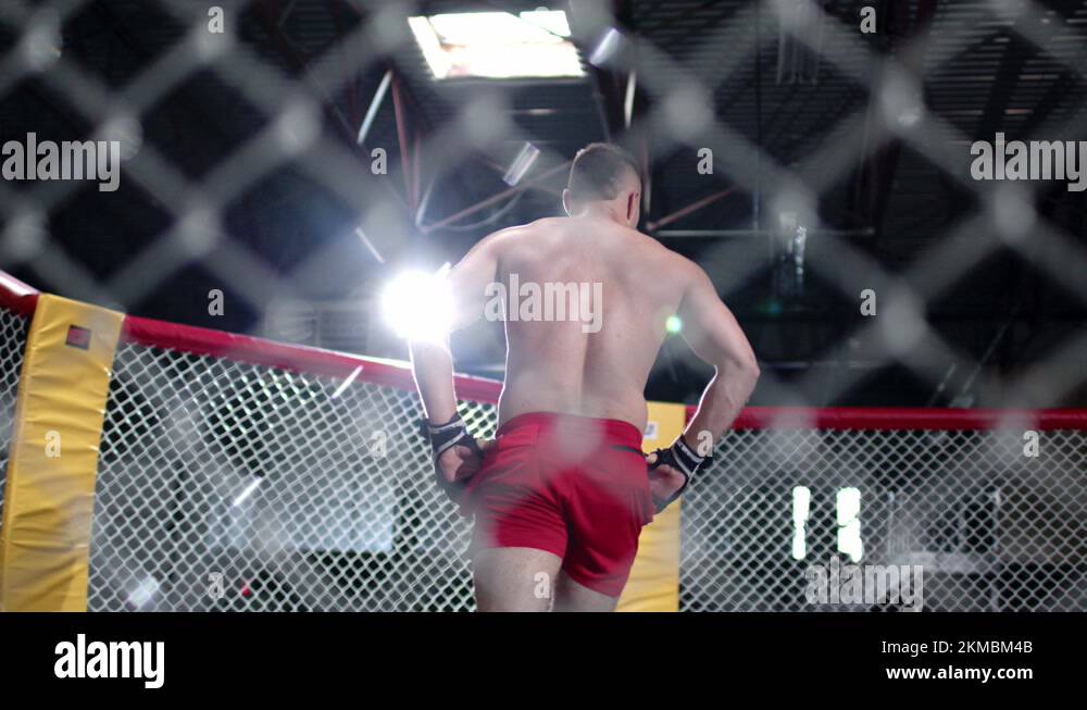 Muscular MMA fighter has finished his training session. Fighter takes ...