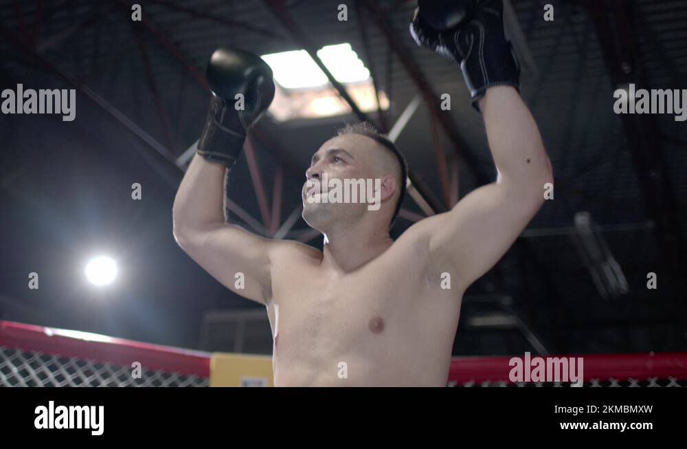 Muscular MMA fighter is inroducing himself inside the octagon and ...