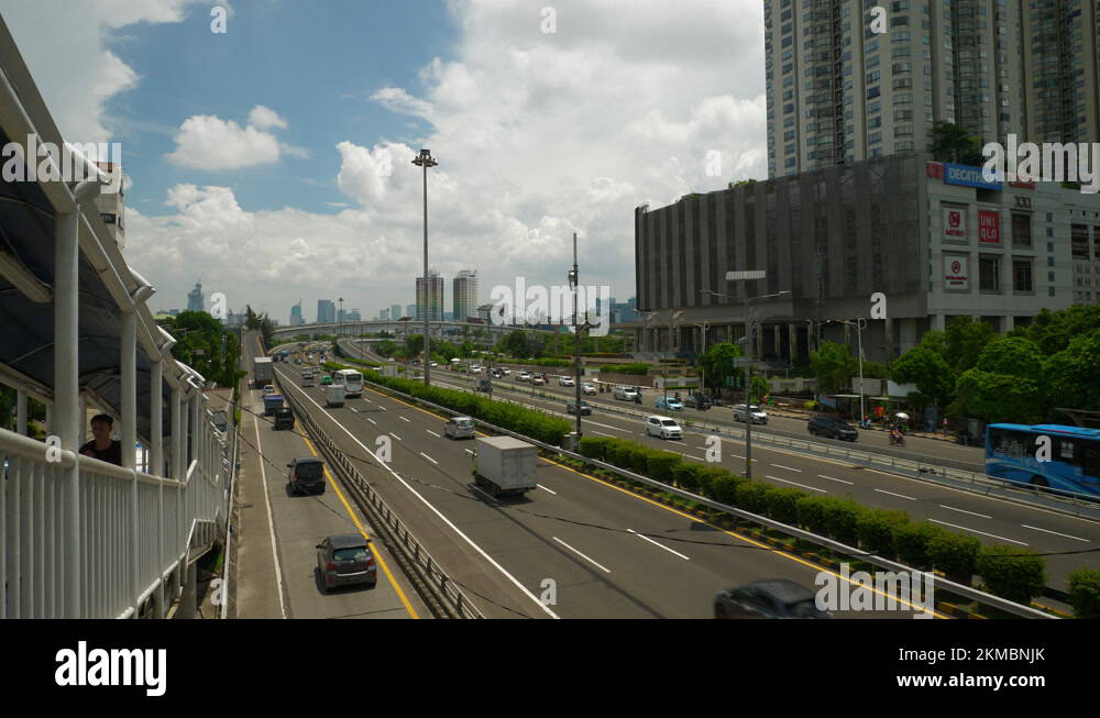 sunny day jakarta city traffic street pedestrian bridge panorama 4k ...