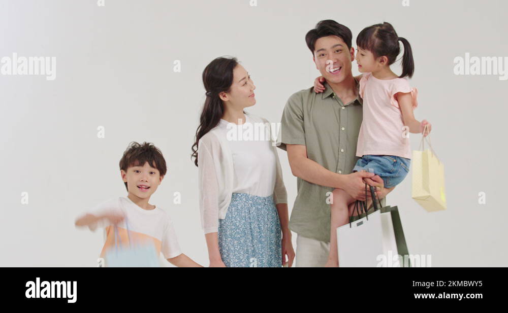 Happy young Chinese family shopping together,4K Stock Video Footage - Alamy