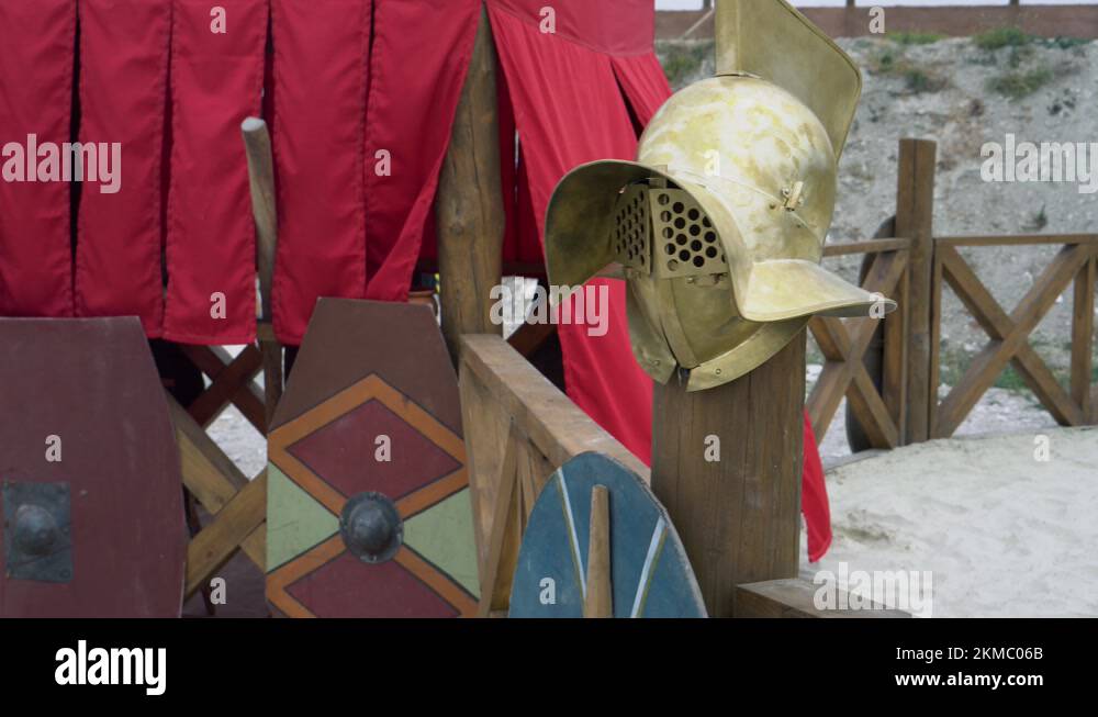 Helmet and shield of a Gladiator in the Roman arena. Gladiatorial fight ...