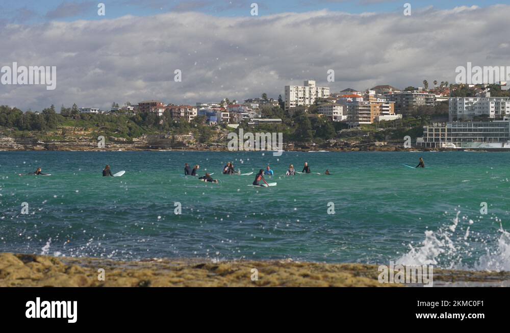 Water splashes against rocks surfing lessons at Bondi slow motion 4K ...