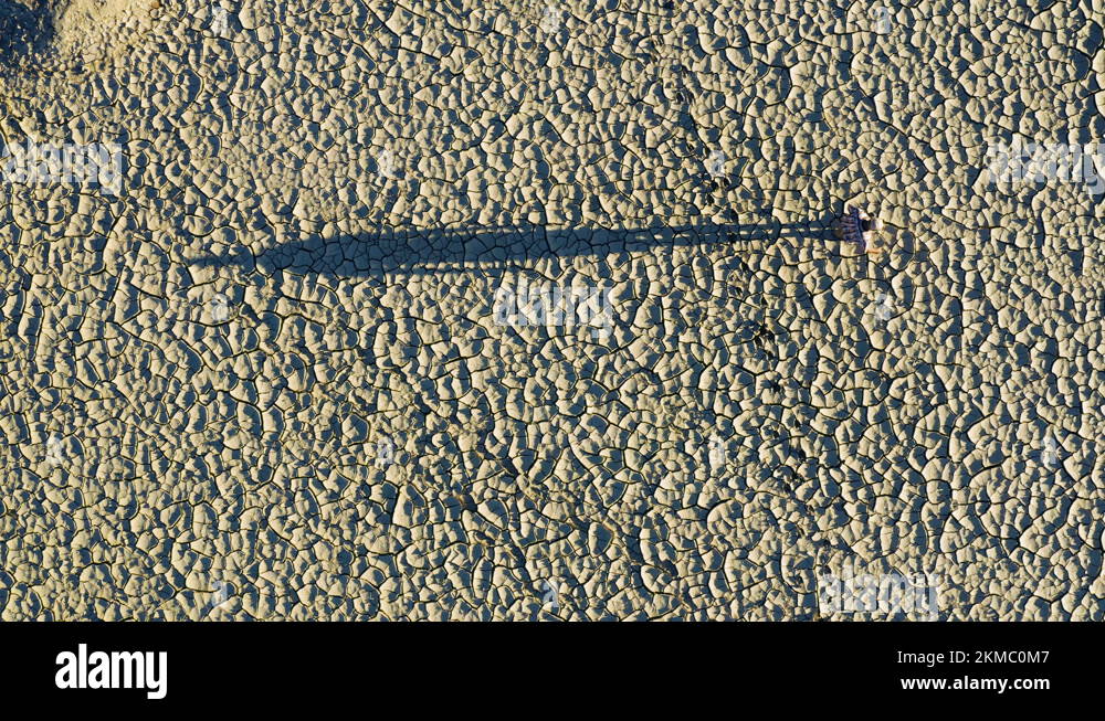 Climate change.Aerial view of a devastated farmer walking across dry ...