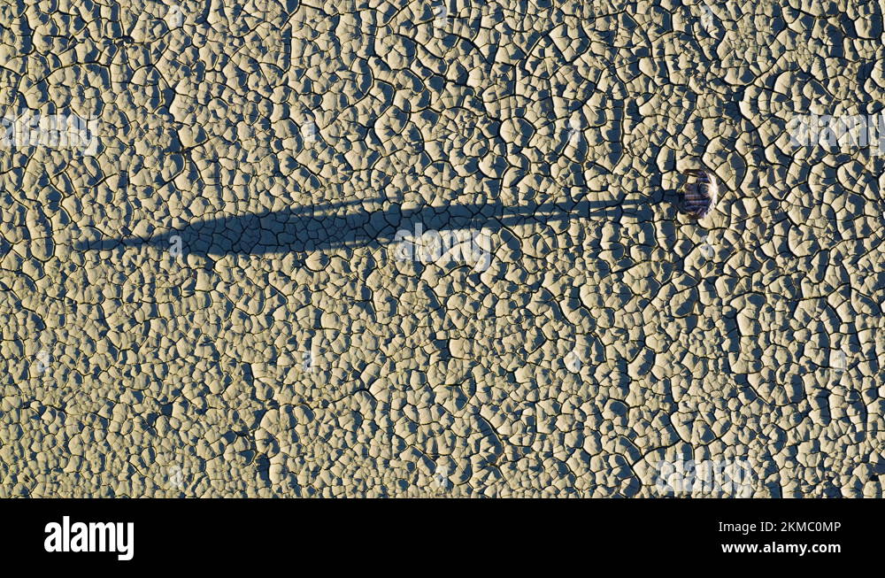 Climate change.Aerial view of a devastated farmer walking across dry ...
