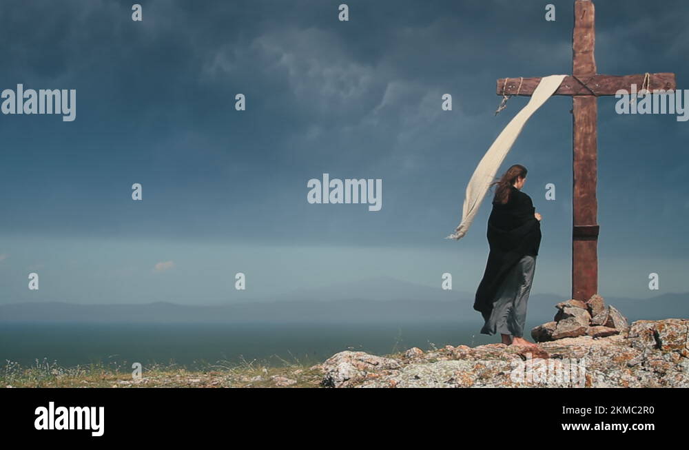 Mary standing by the Holy Cross Stock Video Footage - Alamy