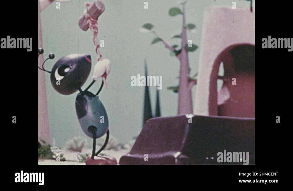 1960s: Stop-motion animation. Ants try to break chocolate with ...