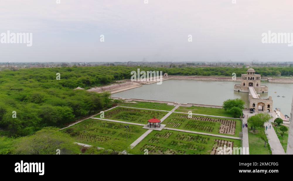 Aerial Flyover Of Sandstone Landmark And Forest At Hiran Minar In ...