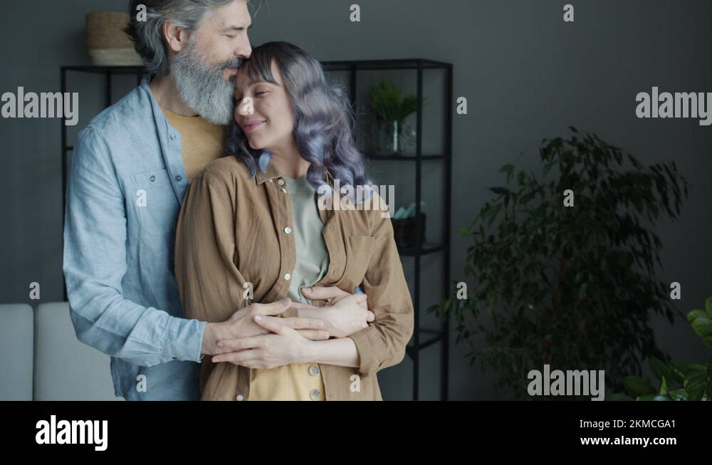 Slow motion of happy people couple hugging and kissing expressing love ...