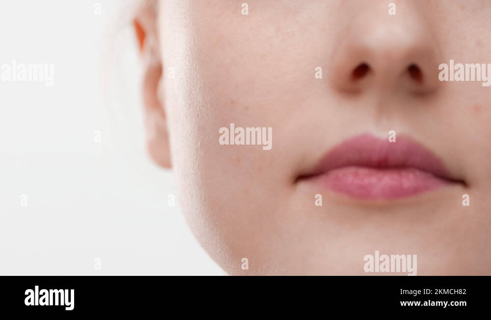 Female face care model stretching her skin on white background Stock ...