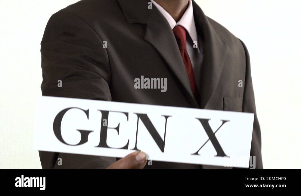 Businessman holding white card with Baby Boomer, Gen X, Gen Y, Gen Z ...