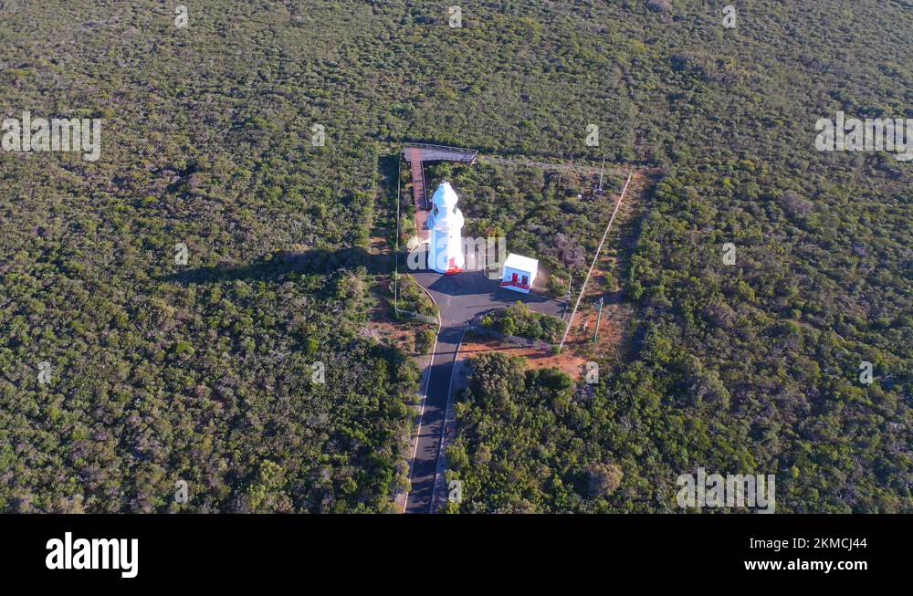 Lighthouse amongst sea of trees overseeing Indian Ocean Stock Video ...