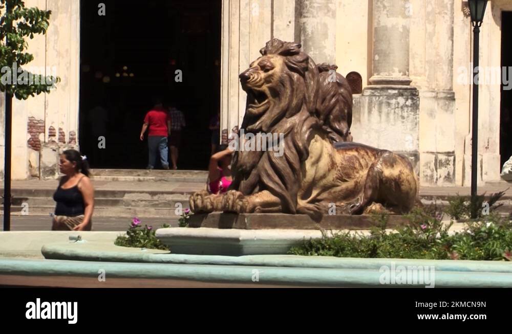 Lion statues at the facade of the Cathedral of the Assumption of Mary ...