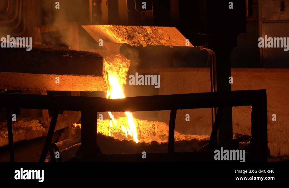 From the blast furnace, molten liquid metal is poured down the chute ...