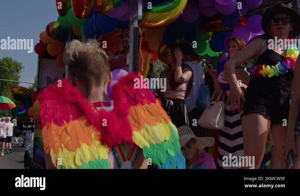 Caravan on LGBTQ pride parade, people with angel rainbow colored wings ...