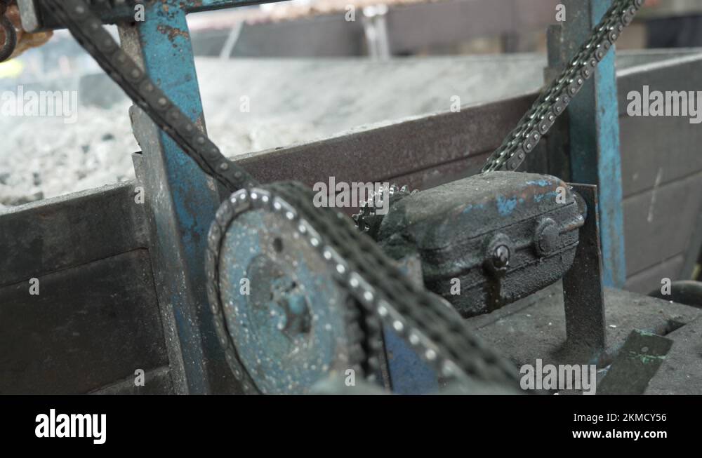 Chain mechanism rotating cog wheels on mechanical spit for hog roast ...