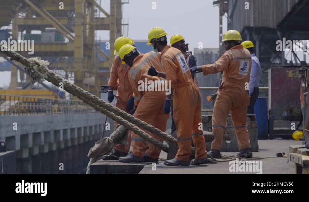 Dockworkers Pulling Together Mooring Line At The Port In Paradip ...