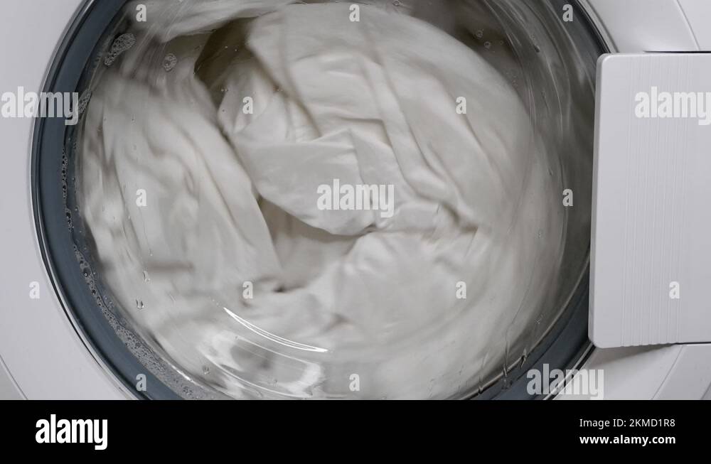 Washing clothes in a washing machine. The laundry is washed Stock Video ...