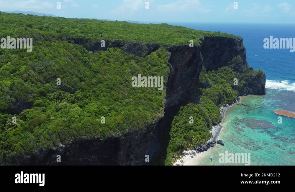 Lush cliffs over Fronton Beach, Las Galeras. Dominican Republic. Aerial ...