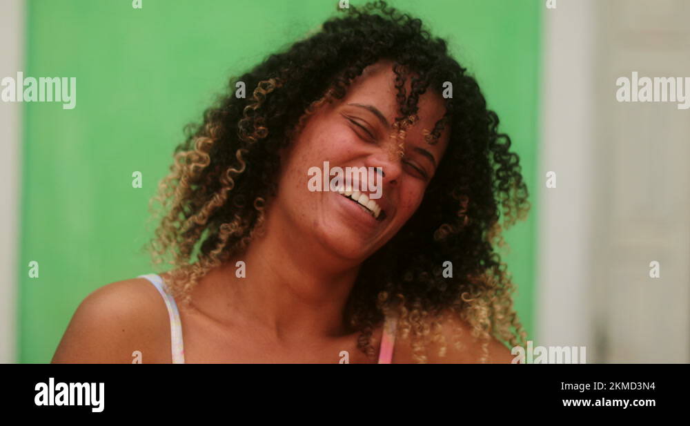Brazilian young woman laugh and smile. African ethnicity girl feeling ...