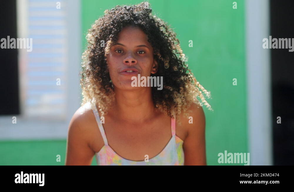 Emotional black woman screaming at camera. Hispanic girl yelling and ...