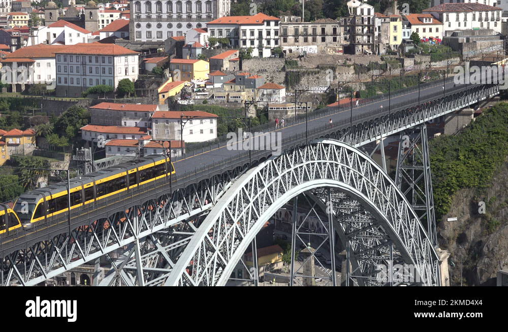 Commuter train on bridge Porto, public transport infrastructure ...